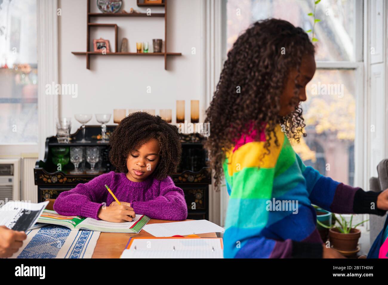 Two girls doing homework together hi-res stock photography and images ...