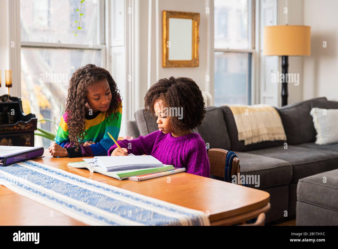 Two girls doing homework together hi-res stock photography and images ...