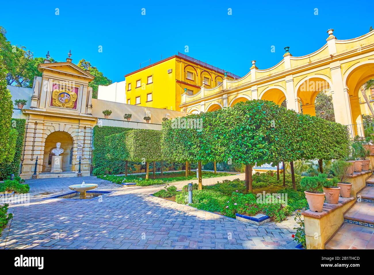 SEVILLE, SPAIN - OCTOBER 1, 2019: The tiny courtyard of Alcazar complex ...