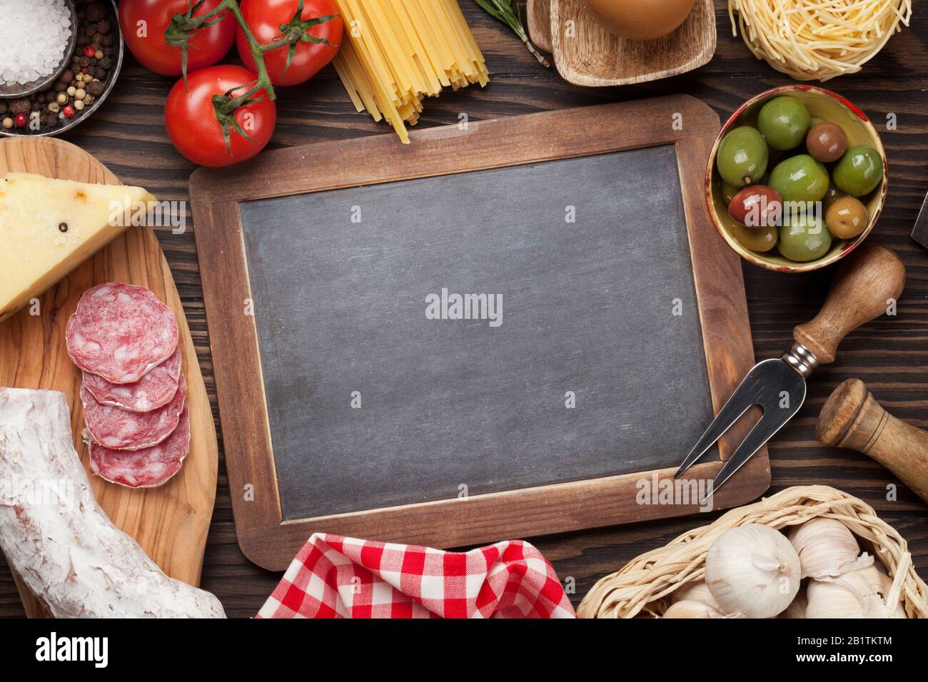 Italian cuisine food ingredients. Pasta, cheese, salami, olives and ...