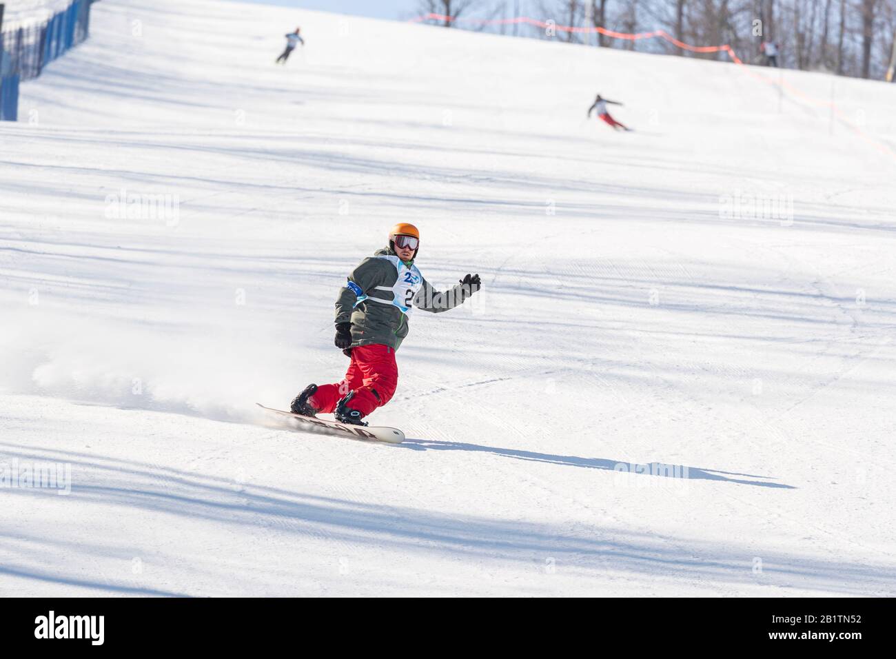 Downhill skiing and snowboarding Stock Photo - Alamy
