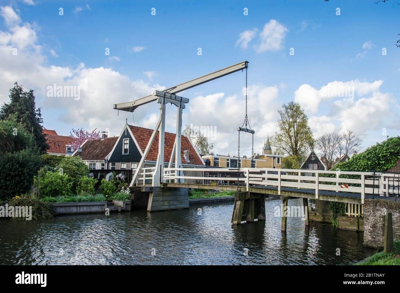 View of the street and traditional dutch wooden bridge in fishing ...