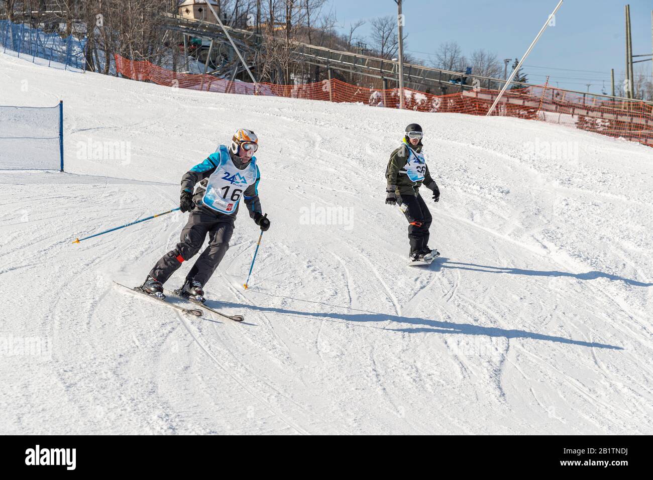 Downhill skiing and snowboarding Stock Photo - Alamy