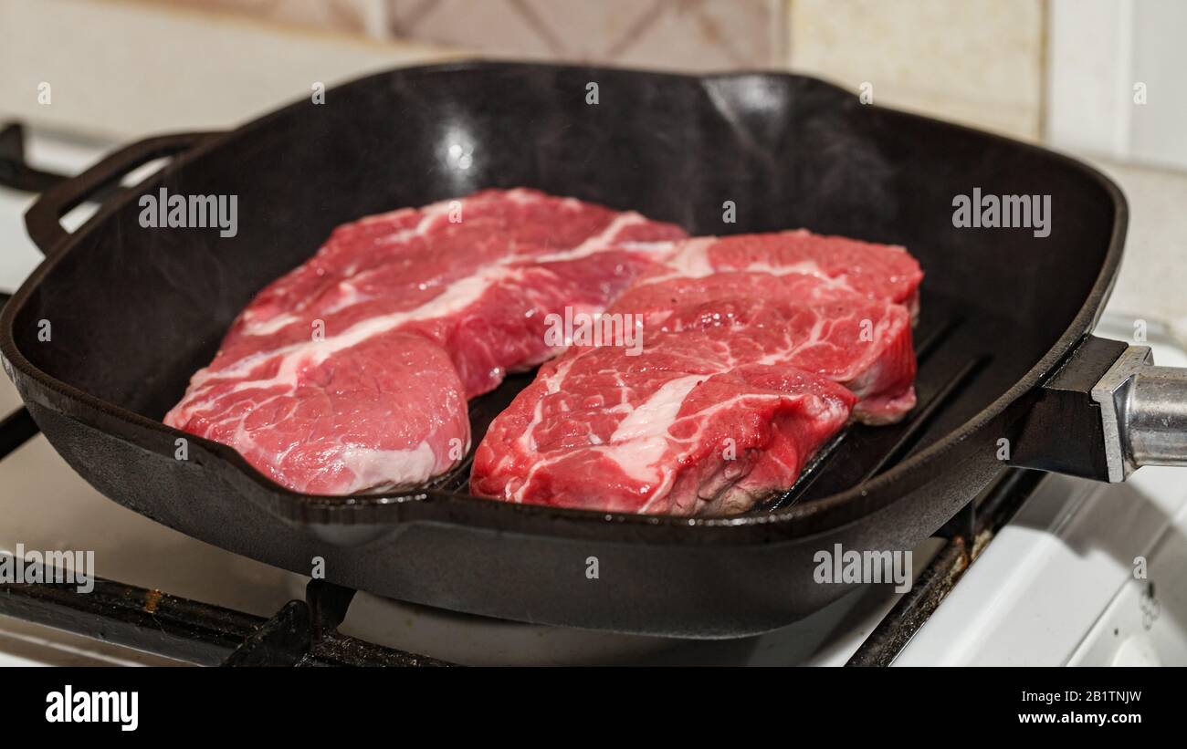 Two fresh raw meat of beef steak Prime Black Angus Chuck roll steak ...