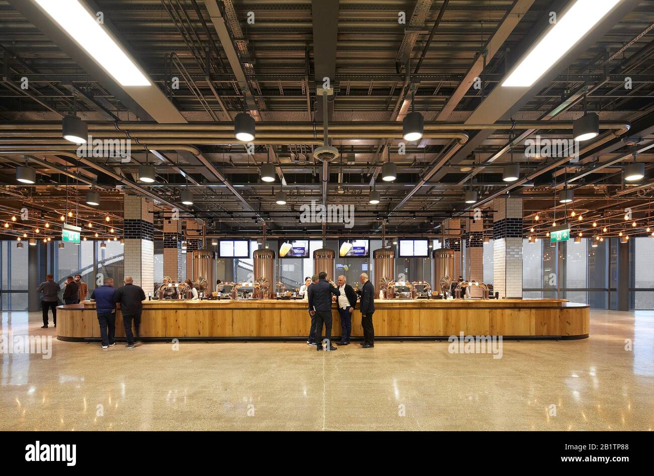 Pub-style feature bar for fans in concourse with window wall. The New ...