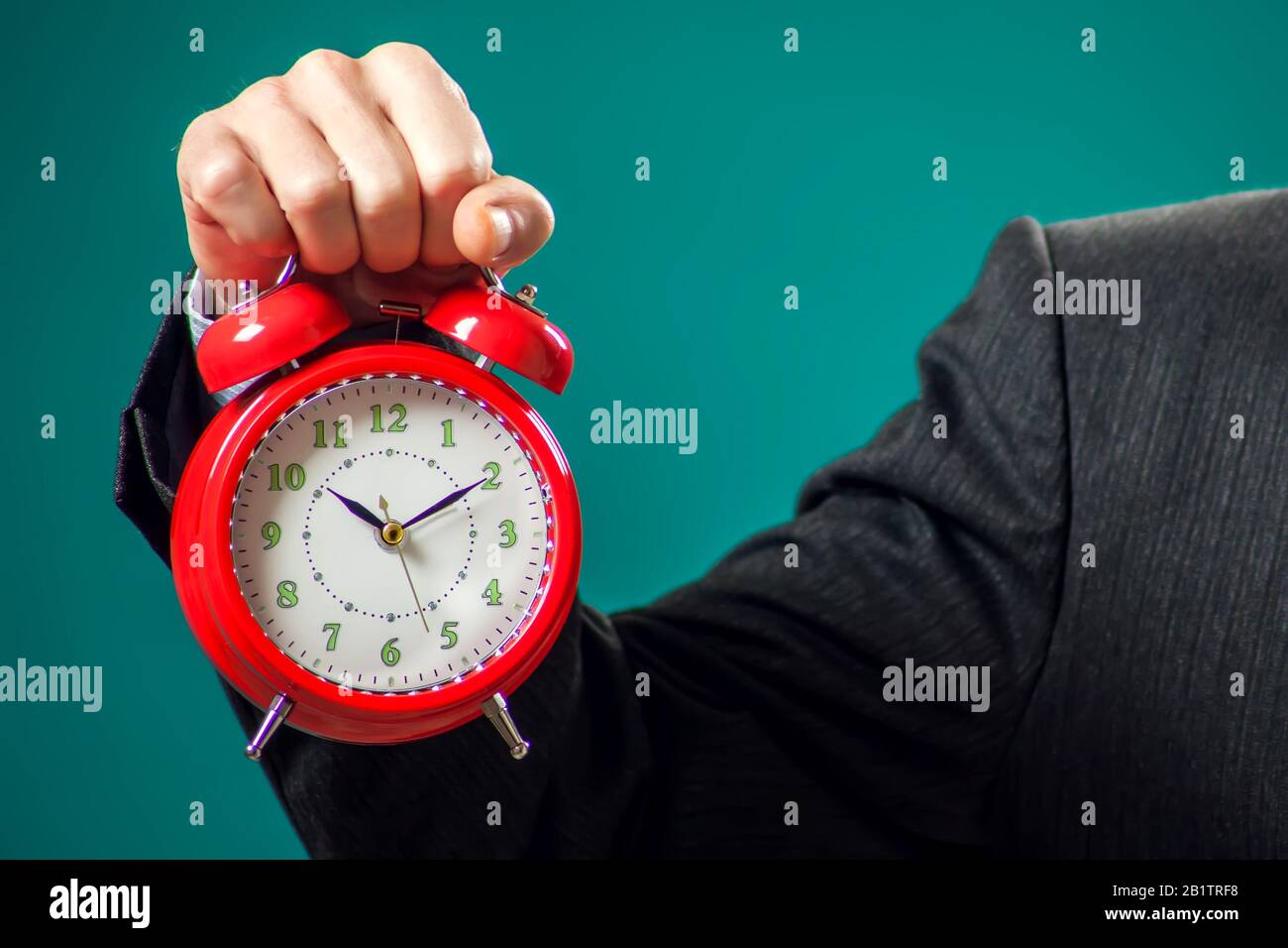 Bearded Businessman In Suit Holding Red Alarm Clock Time Management