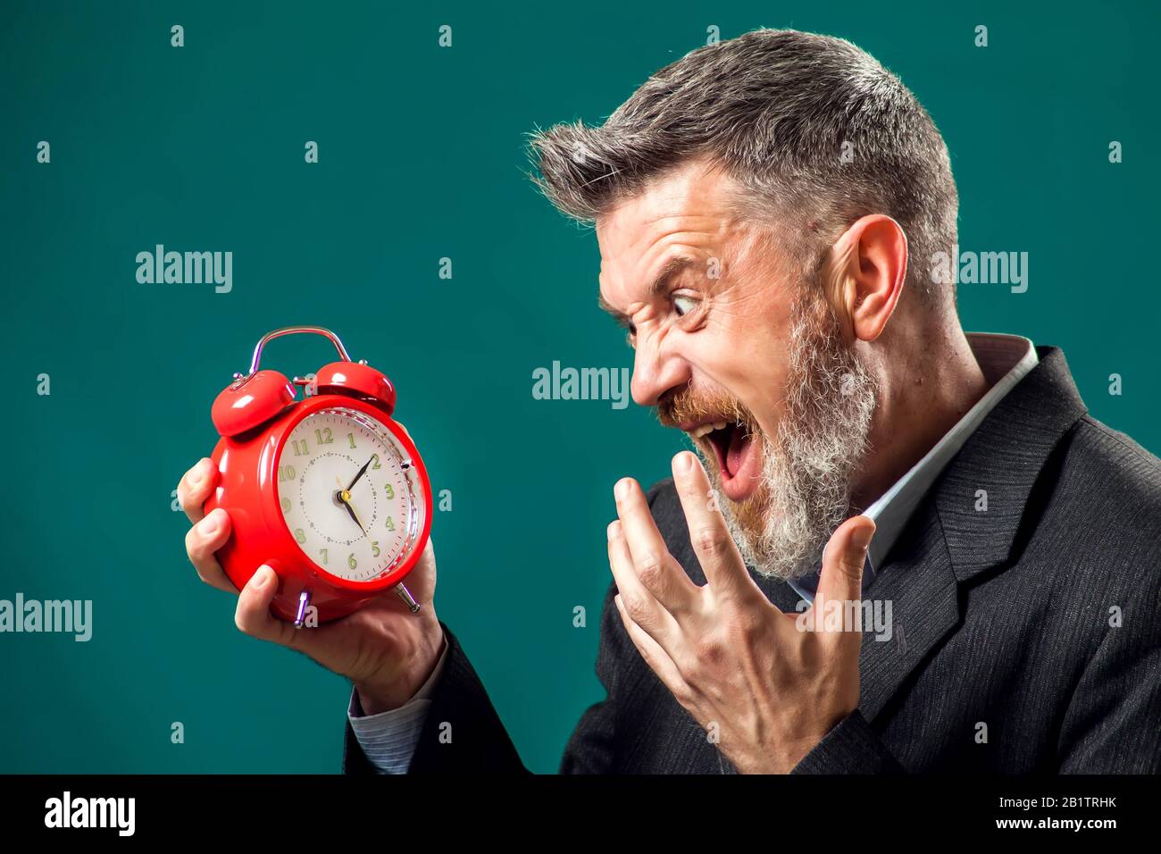 Angry man alarm clock in hi-res stock photography and images - Alamy