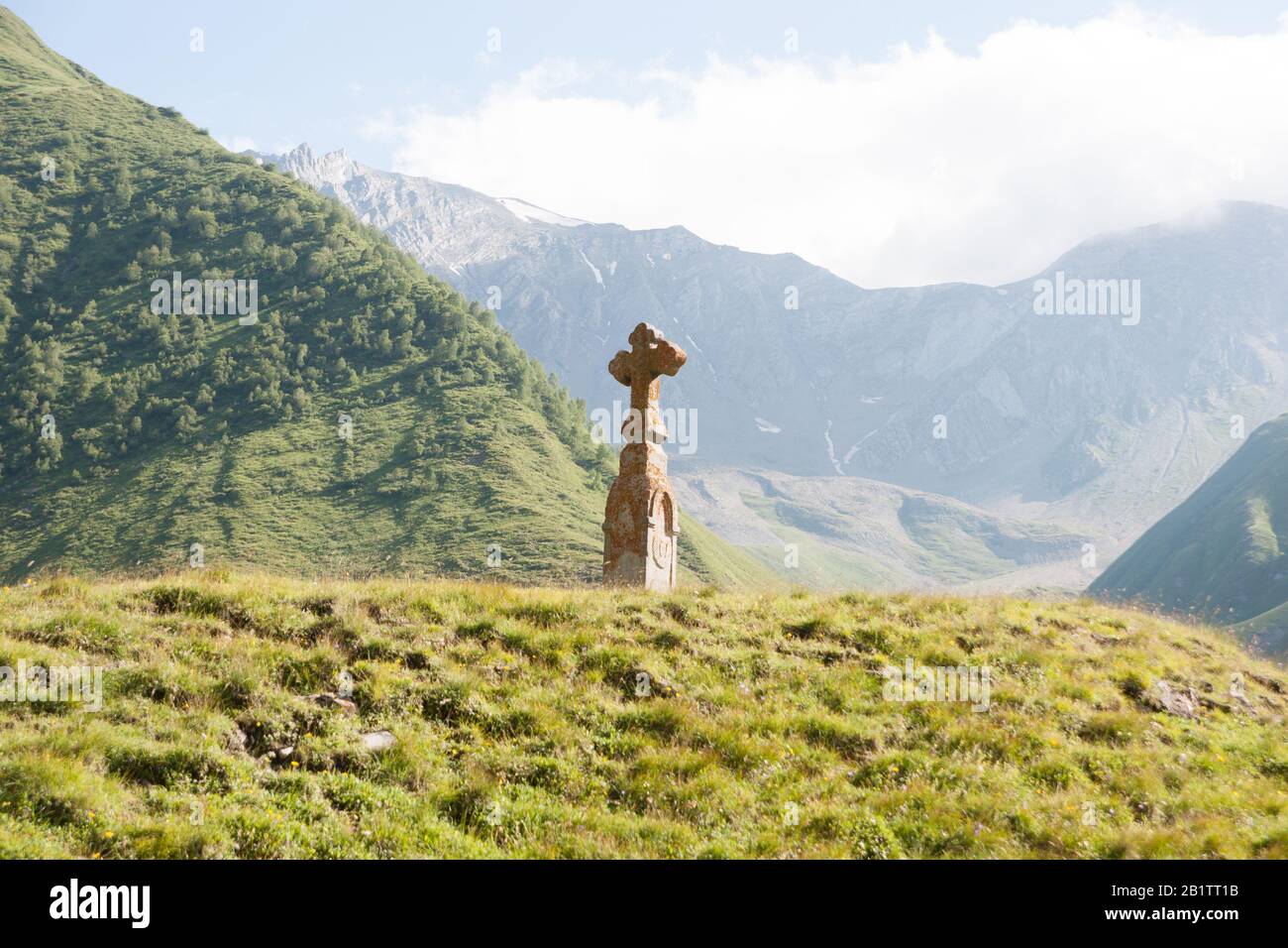 The cross in the mountains hi-res stock photography and images - Alamy