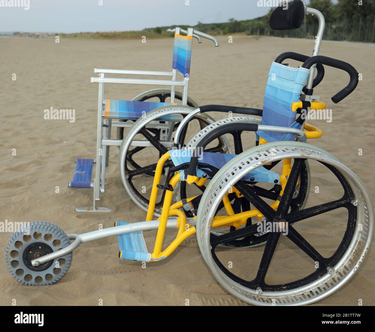 two special wheelchairs with very large aluminum wheels to move easily ...