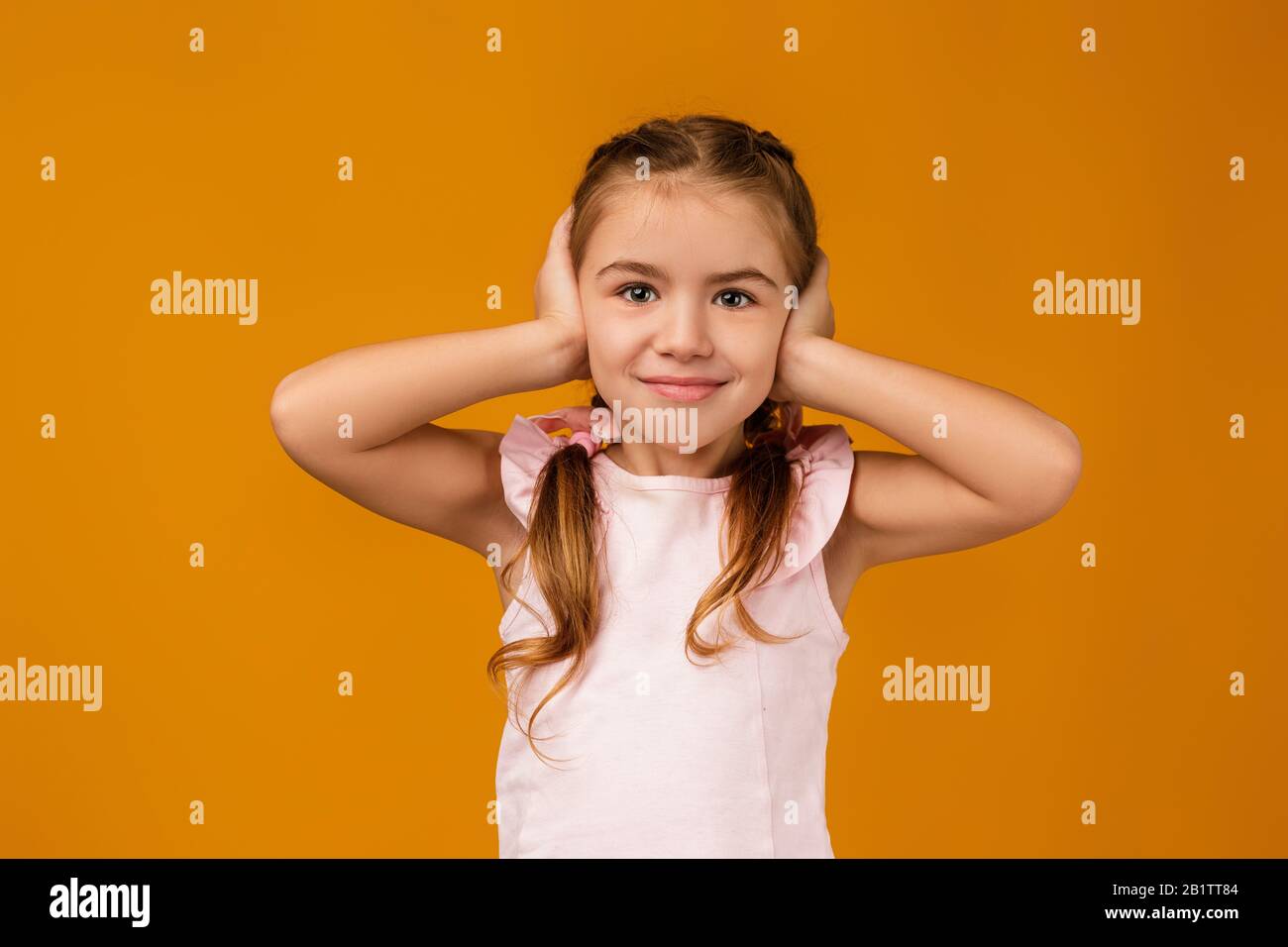 Hand to ear child hi-res stock photography and images - Alamy