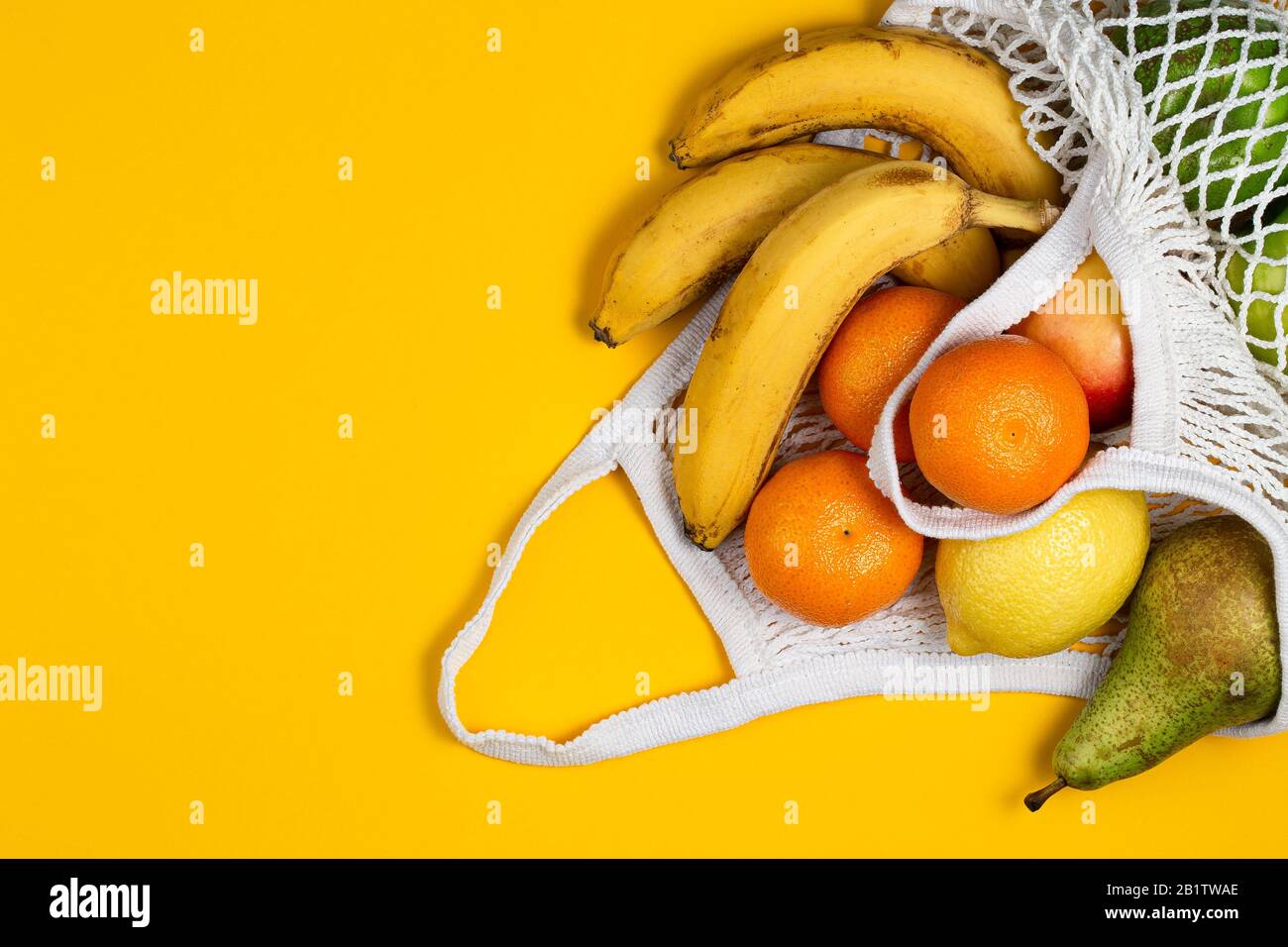 Zero waste plastic free concept. Fresh fruit in a mesh net bag, top ...