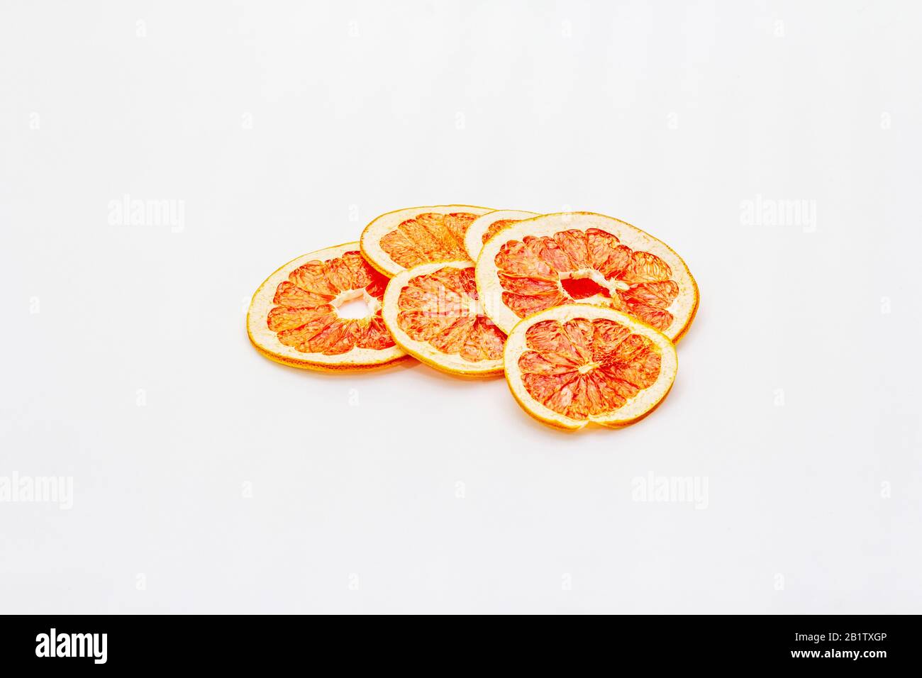 Dried slices of grapefruit isolated on white background. Healthy eating ...