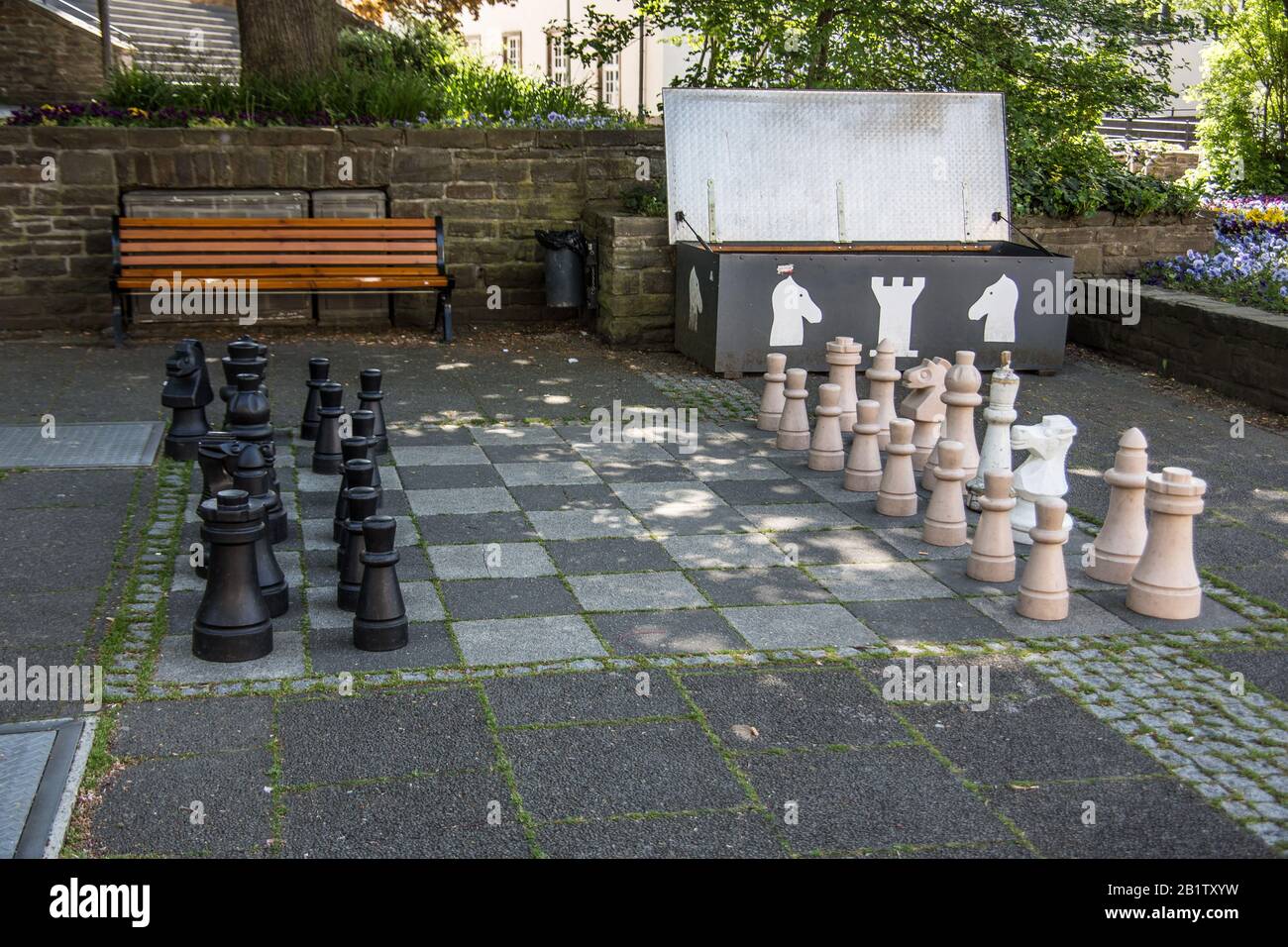 Chess set on the pavement in the park Stock Photo - Alamy