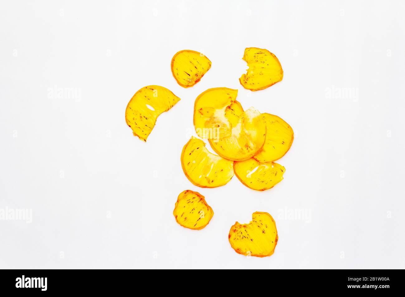 Dried slices of persimmon isolated on white background. Healthy eating ...
