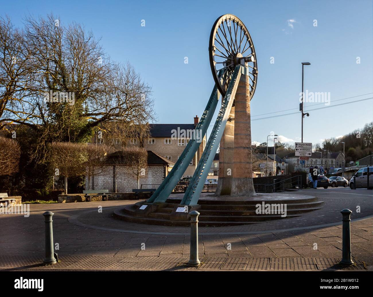 Restored mining pit wheel outside the Radstock Museum. North Somerset ...