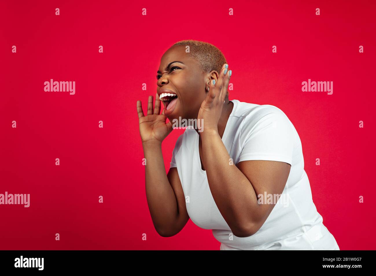 Shouting, screaming angry. African-american young woman's portrait on ...