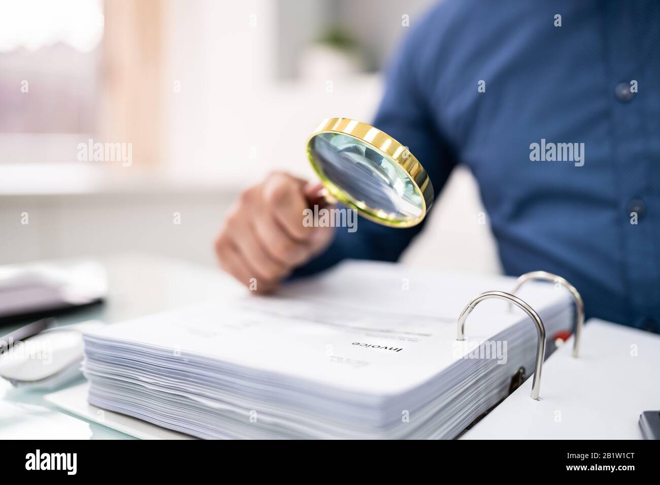 Businessman Looking At Document Through Magnifying Glass Stock Photo ...