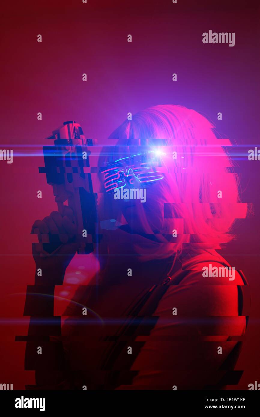 Girl with blaster in the futuristic battle. Concept virtual reality ...