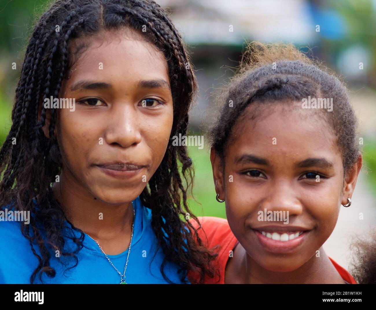 Young papua girls in Sorong harbor - Occidental Papua, Indonesia Stock ...