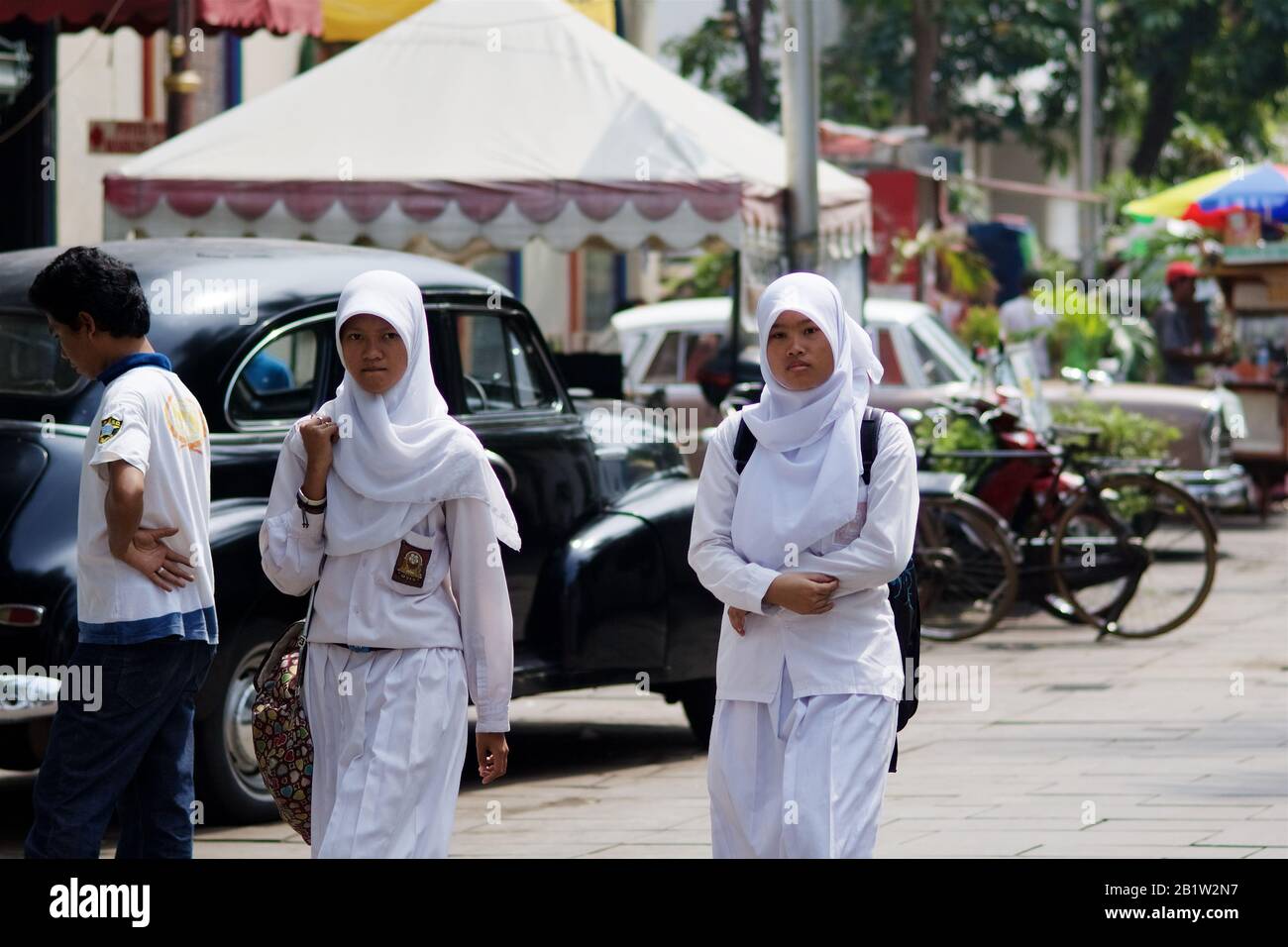 Veiled Indonesian muslim student girls with uniform in Batavia ...