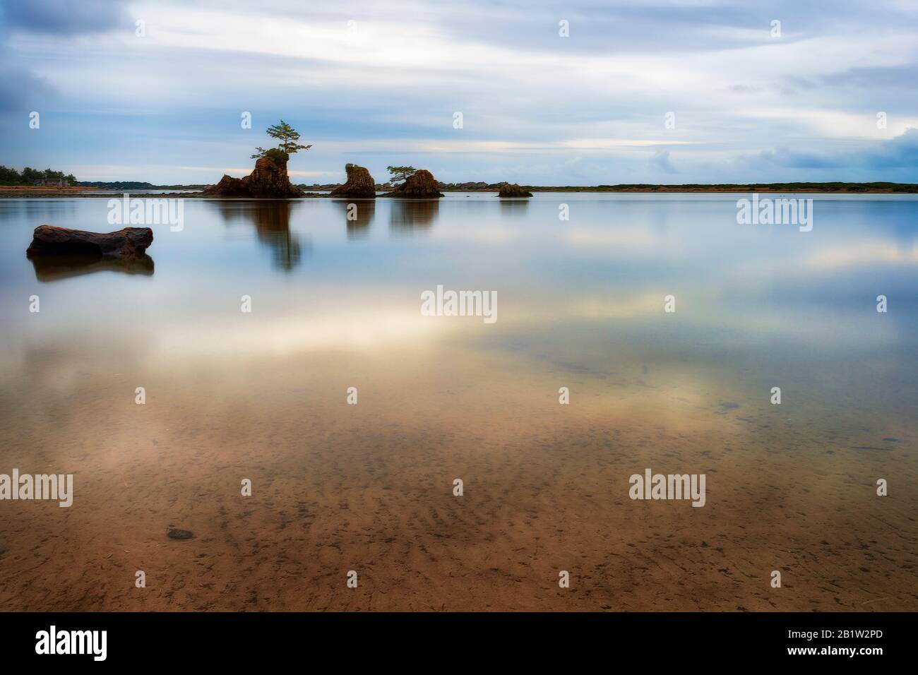 A receding storm leaves behind calm waters and deserted beach in the ...