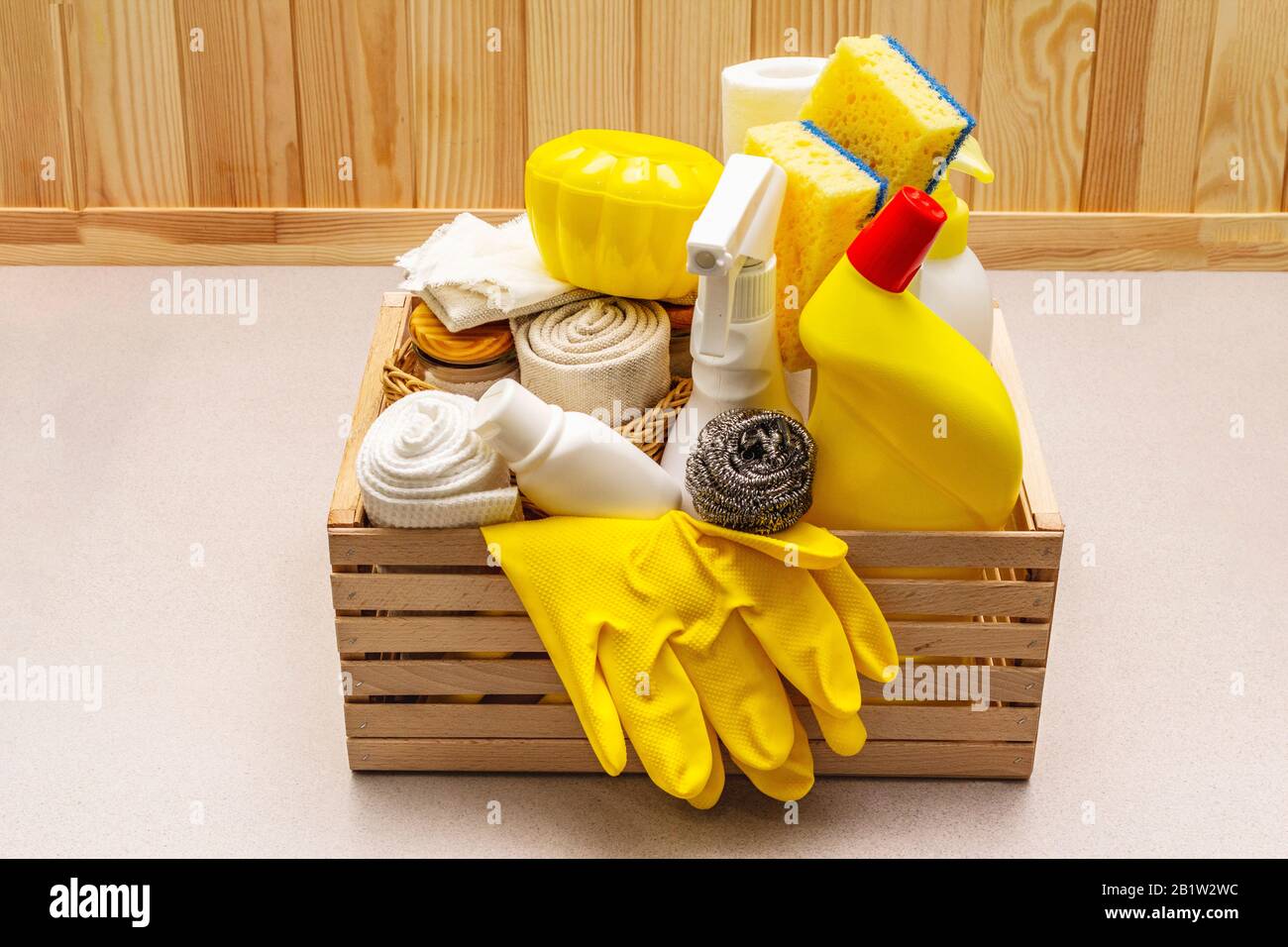 House cleaning product in wooden box. Spray, bottle, gloves ...