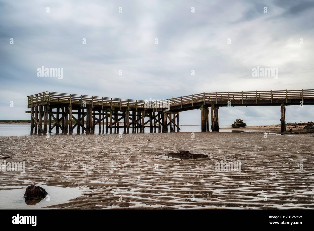 A receeding storm leaves behind calm waters and deserted beach in the ...