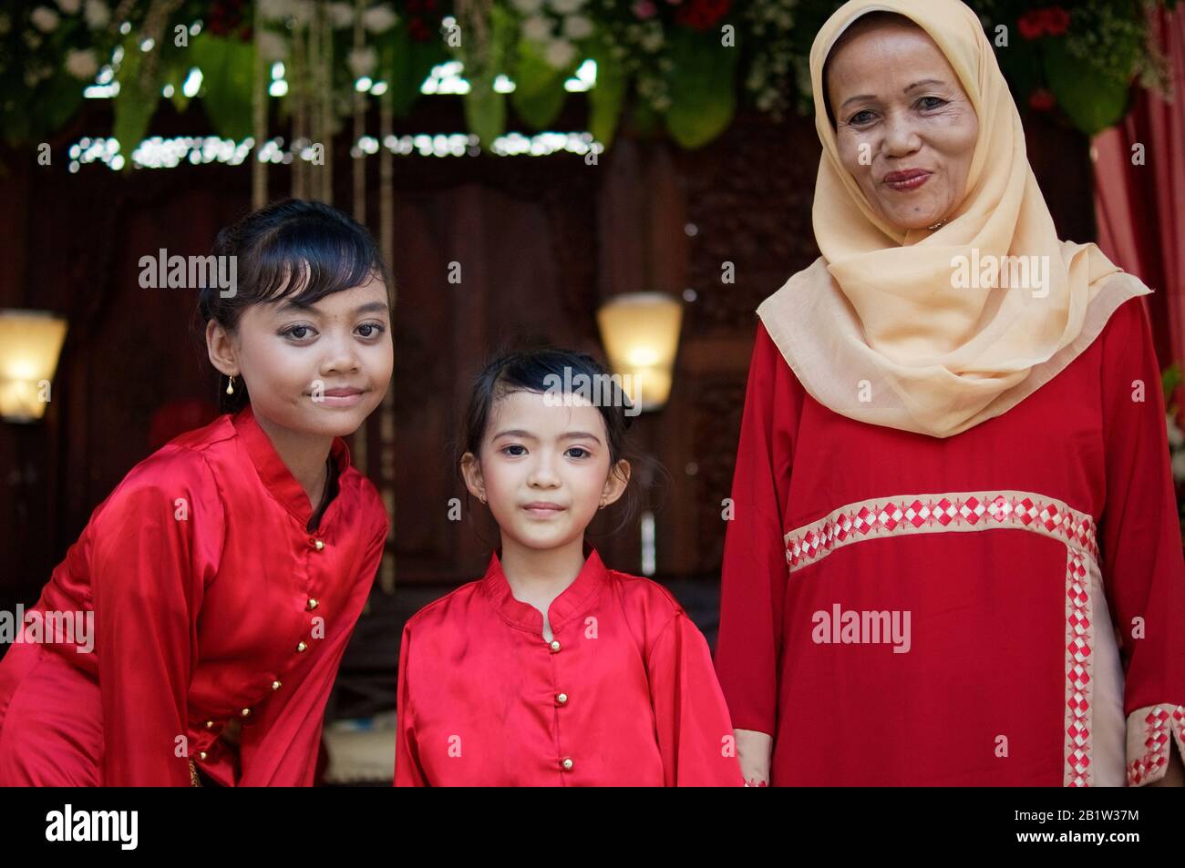 Little Indonesian girls in traditional red dress and veiled muslim ...