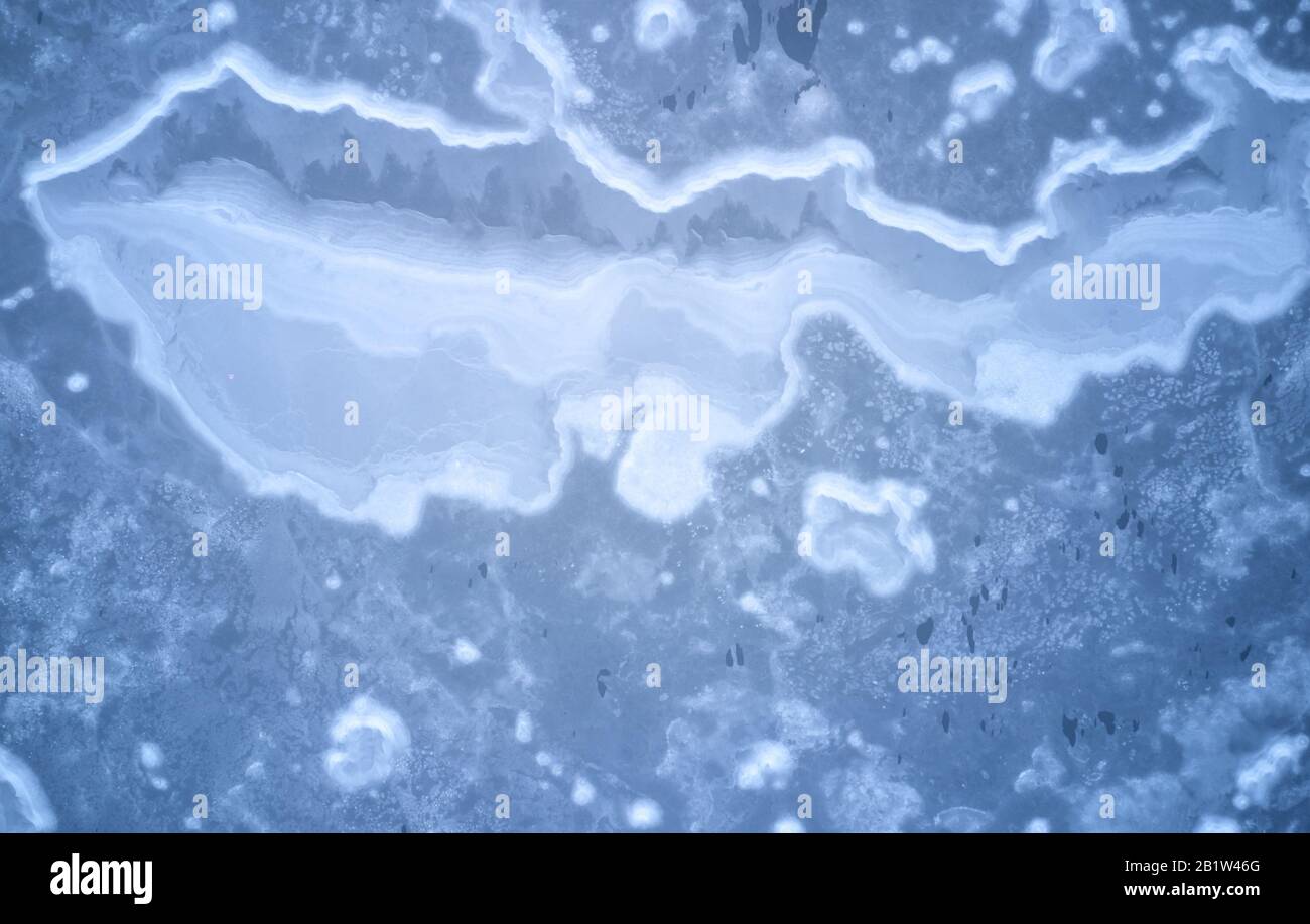 Abstract frozen lake texture above drone top view. Blue ice texture ...