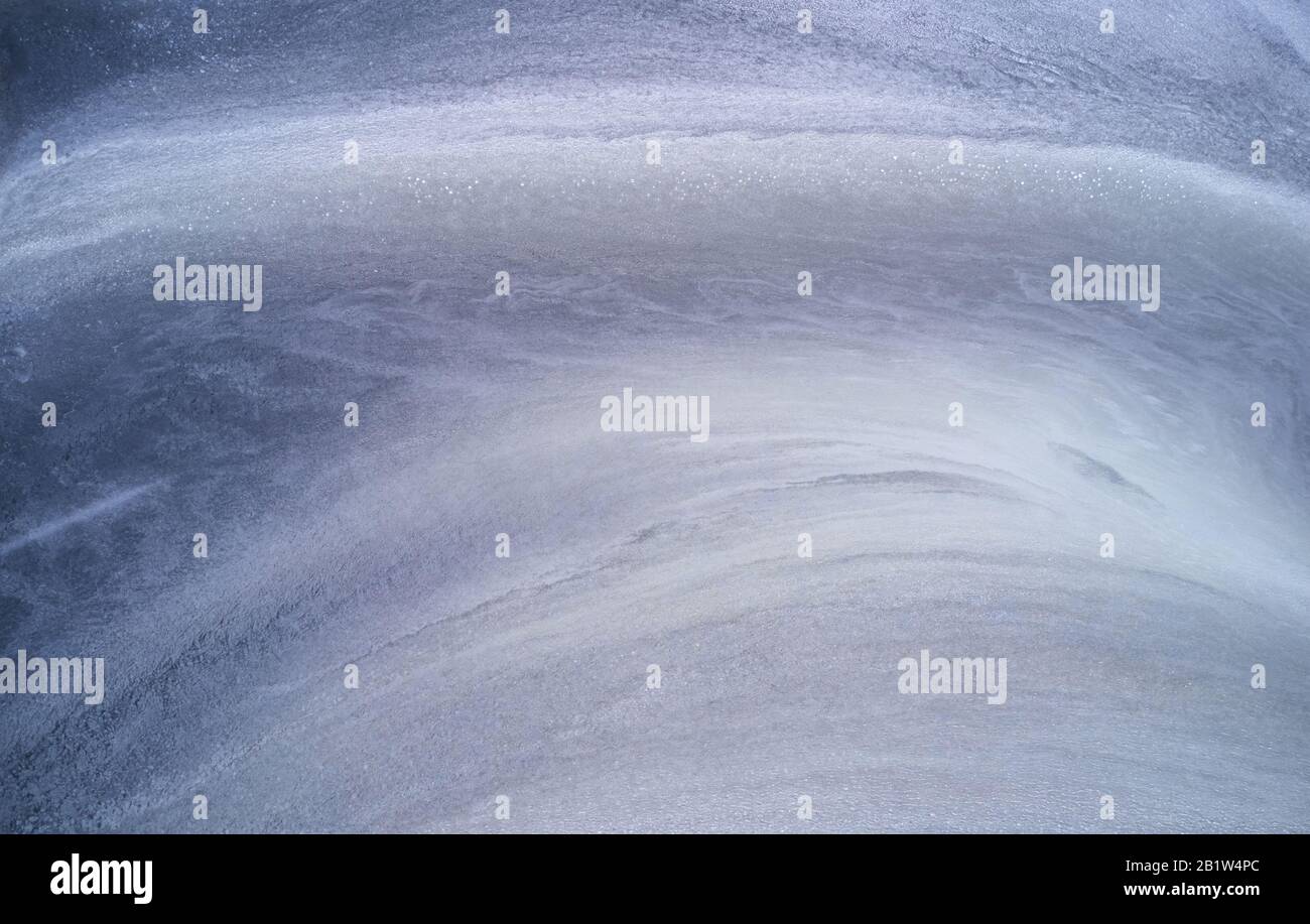 Abstract pattern on lake ice above top view. Frozen river background ...