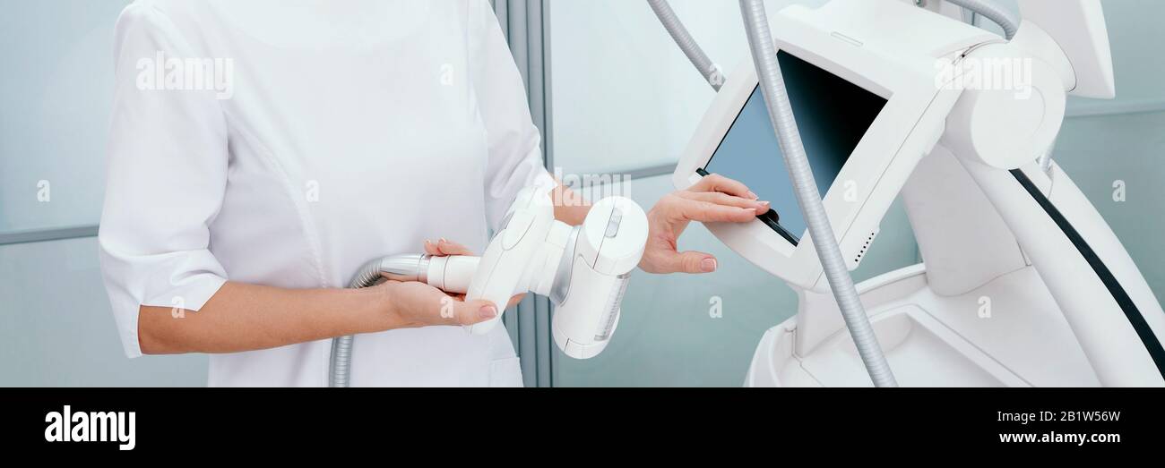 The masseur is preparing to make an hardware massage in a beauty salon ...