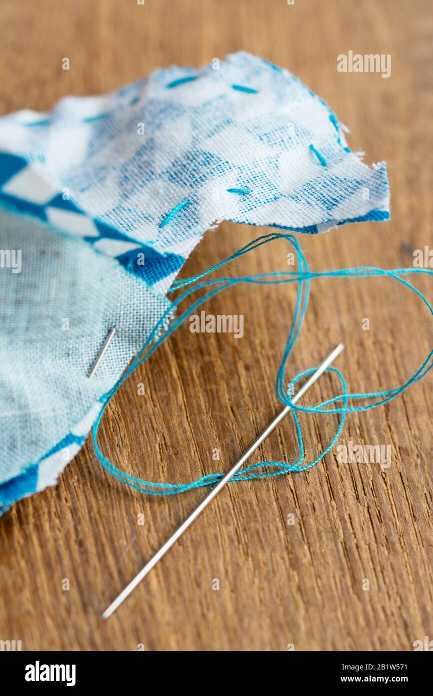 Sewing together two fabric parts of a soft toy Stock Photo - Alamy