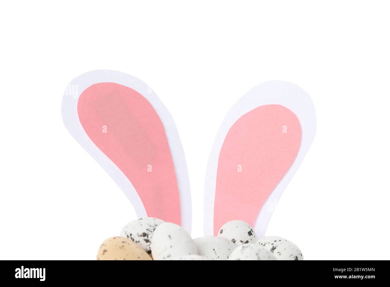 Cup with eggs and bunny ears isolated on white background Stock Photo ...