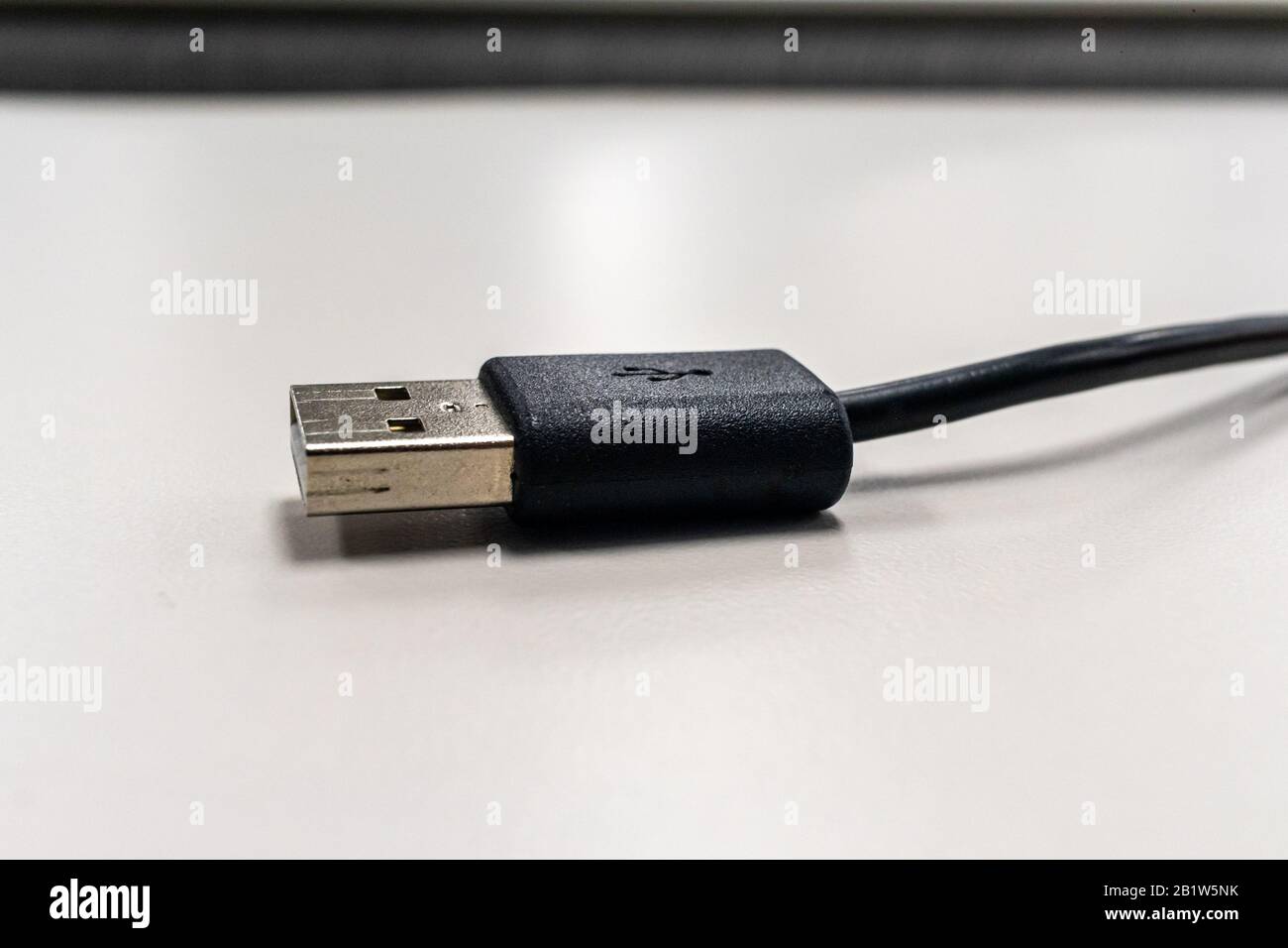 The end of a black USB cable with a male connector Stock Photo - Alamy