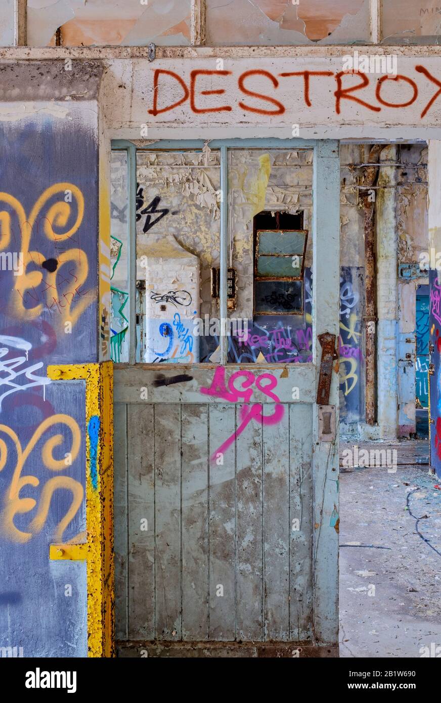 Urban neglected factory, isolated, deserted, forgotten with spray paint ...