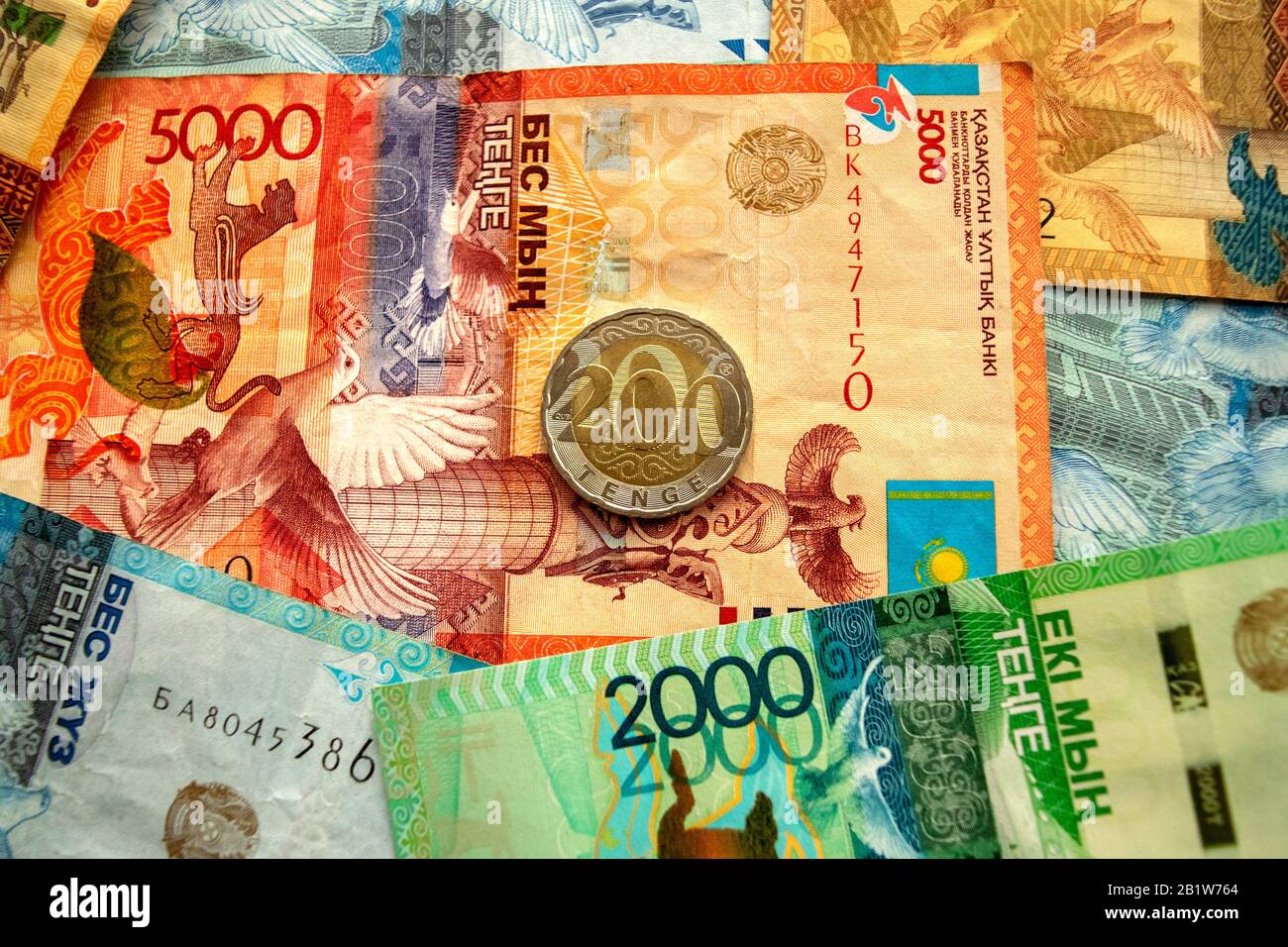 Kazakhstan national currency, top view of mixed tenge banknotes. New ...
