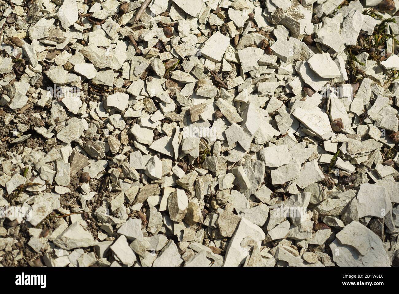 A layer of grey limestone rubble for the background. Stone texture ...