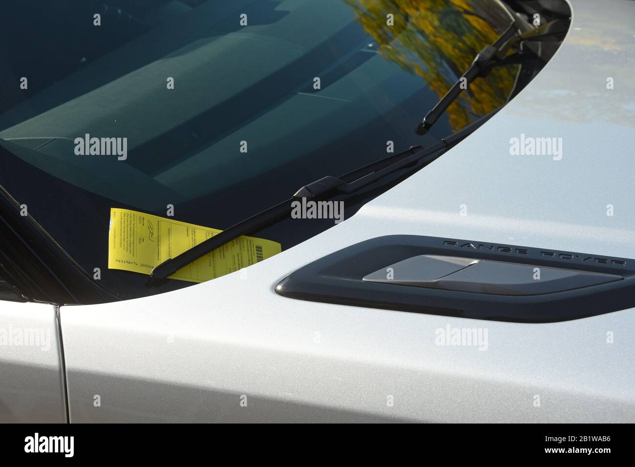 Parking ticket on the windshield Stock Photo - Alamy