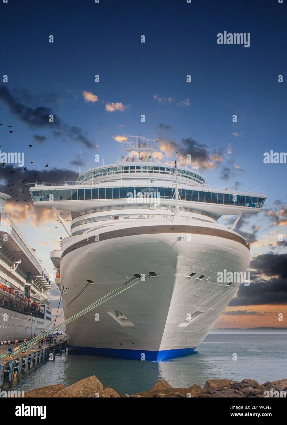 Cruise Ship with Bridge Moored at Tropical Island Stock Photo - Alamy