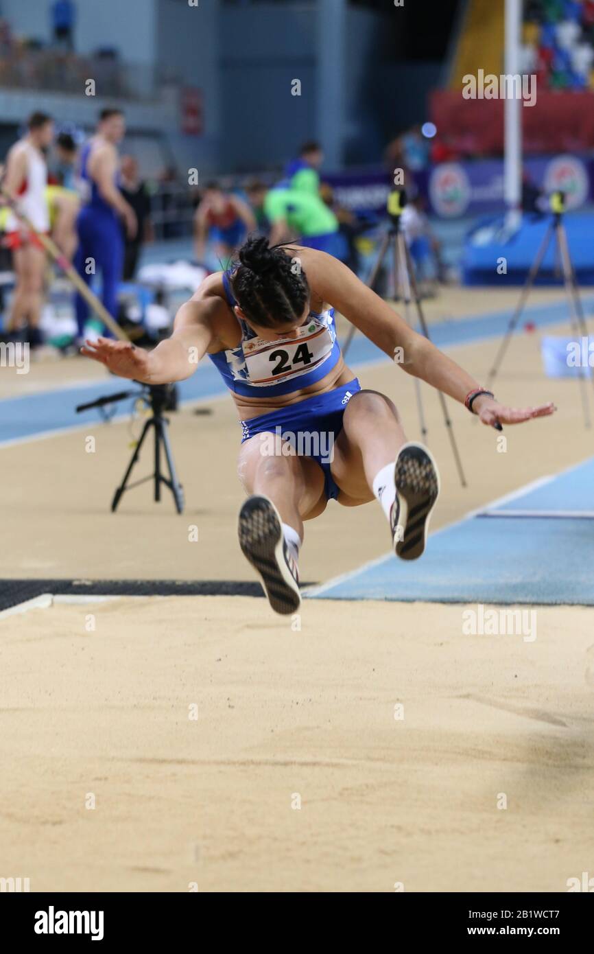 ISTANBUL, TURKEY - FEBRUARY 09, 2020: Undefined athlete long jumping ...