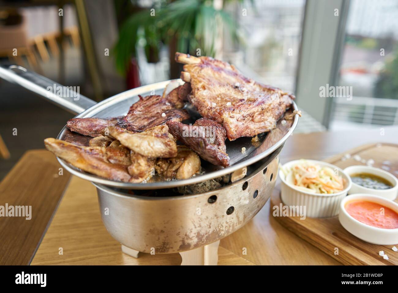 Various grilled meat set heated on coals. Barbecue restaurant menu ...
