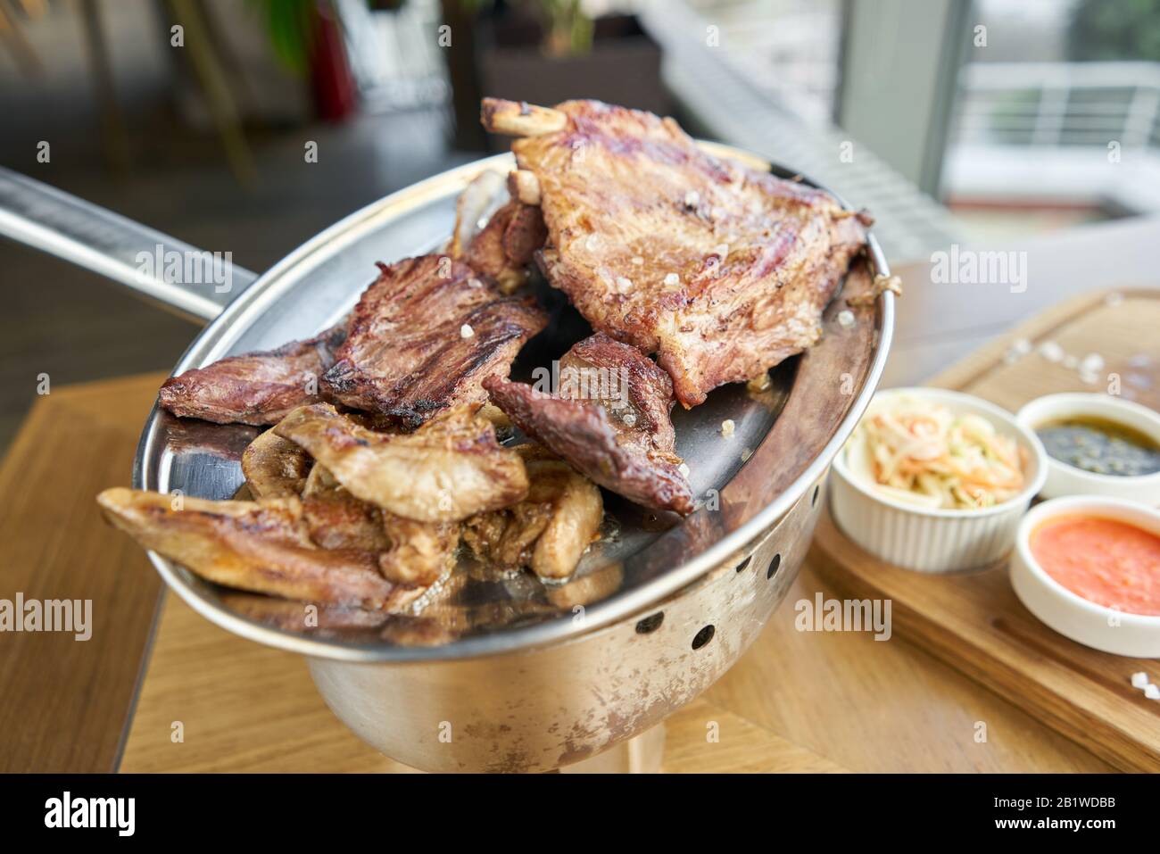 Various grilled meat set heated on coals. Barbecue restaurant menu ...