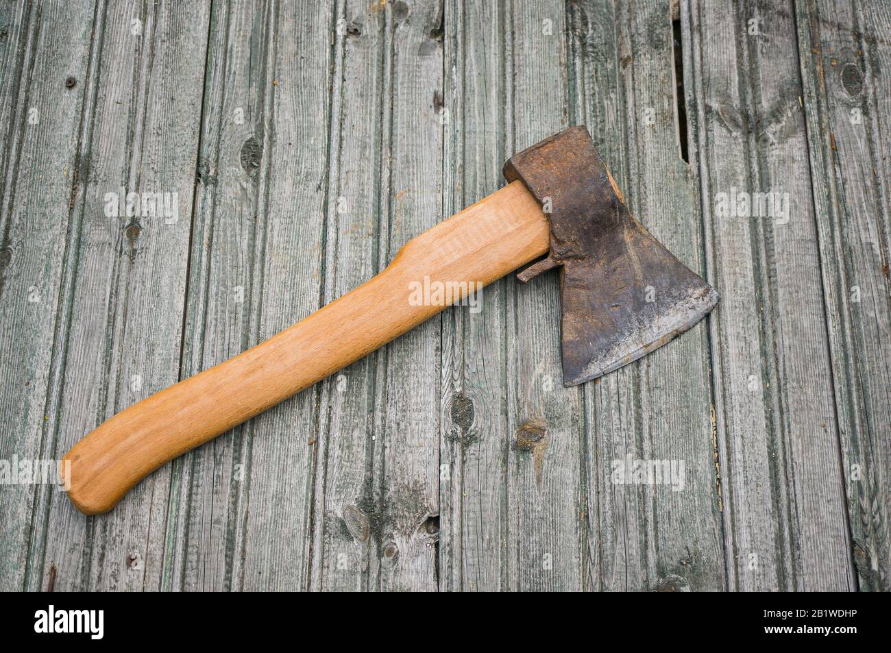 Vintage ax on wooden background. Soft focus. Copy space Stock Photo - Alamy