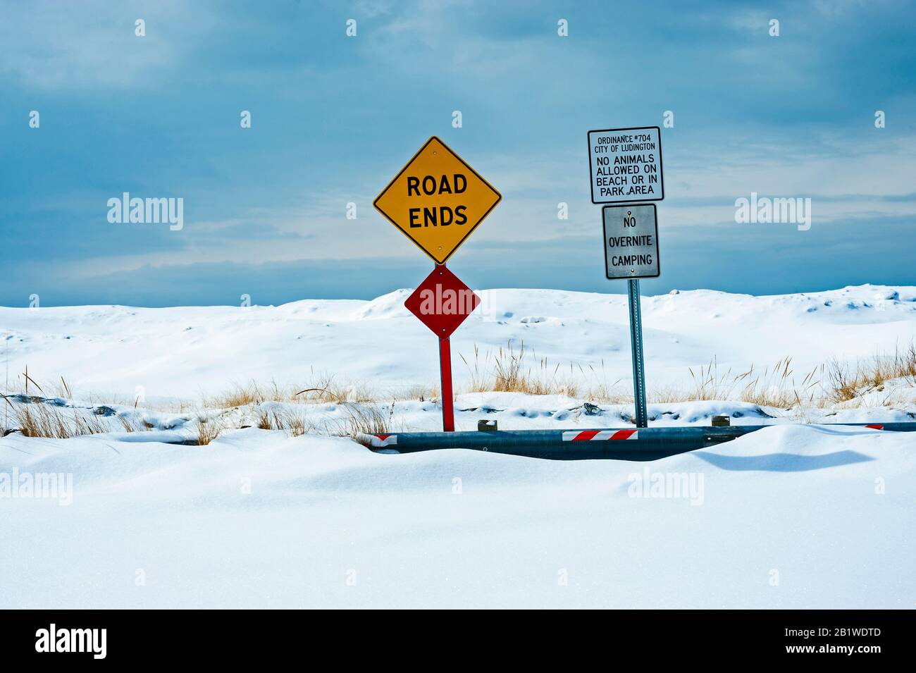 Road Ends sign at the end of Ludington Avenue with Lake Michigan beyond ...