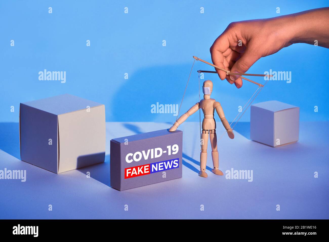 Covid19 novel coronavirus rumors. Sinister hand control wooden puppet ...