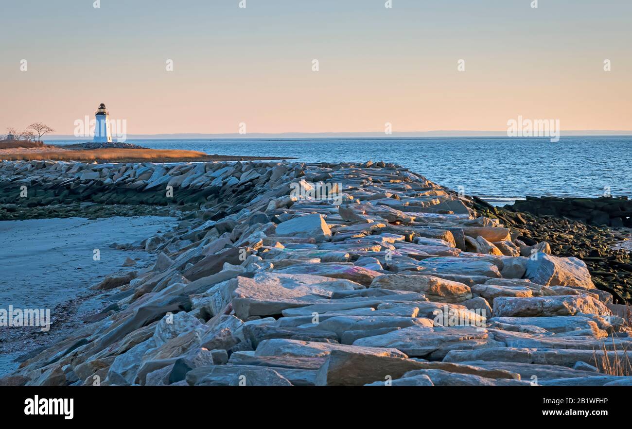 Seaside Point lighthouse at sunset from seawall view Stock Photo - Alamy