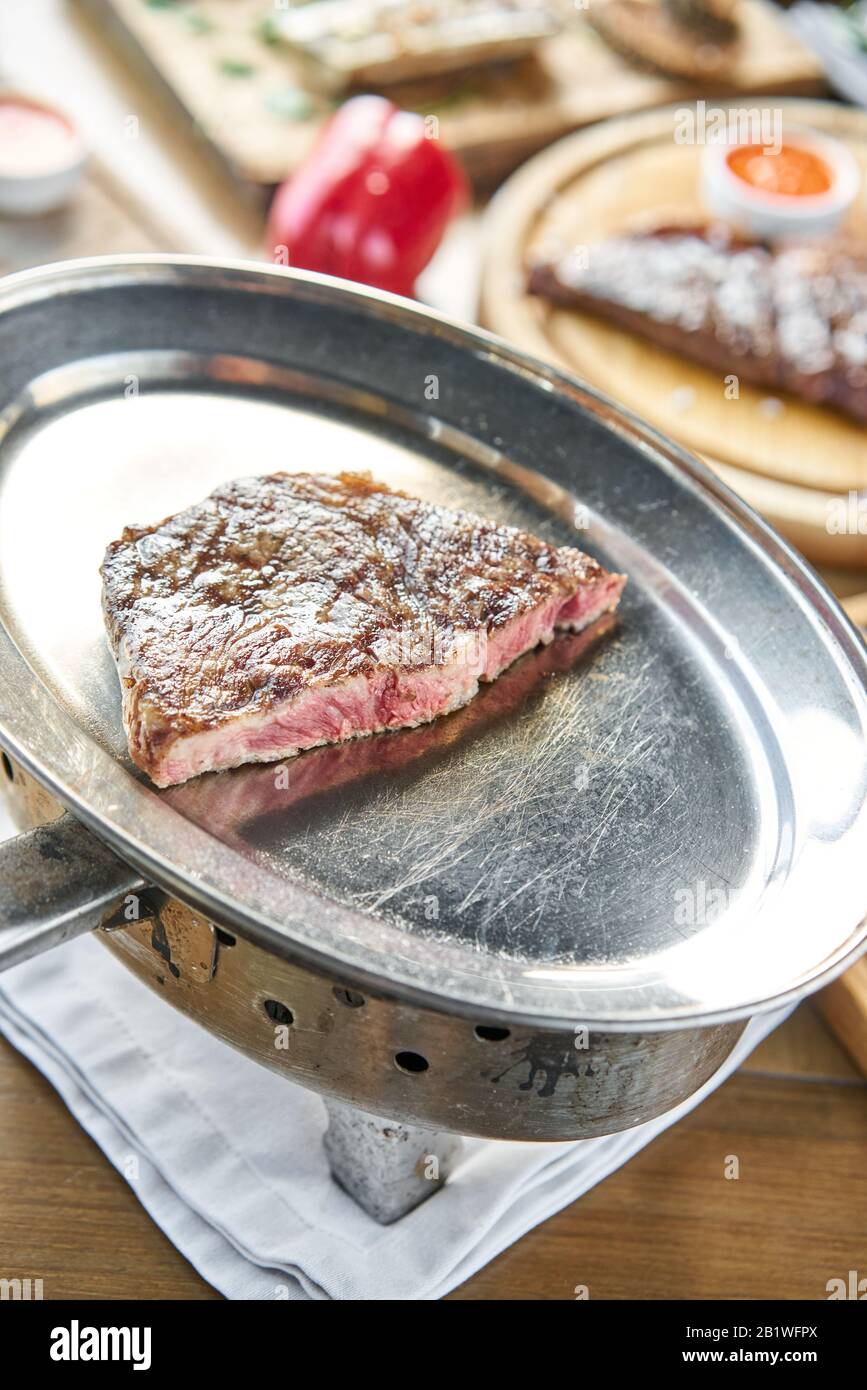 Grilled striploin steak. The strip steak or New York strip On a metal ...