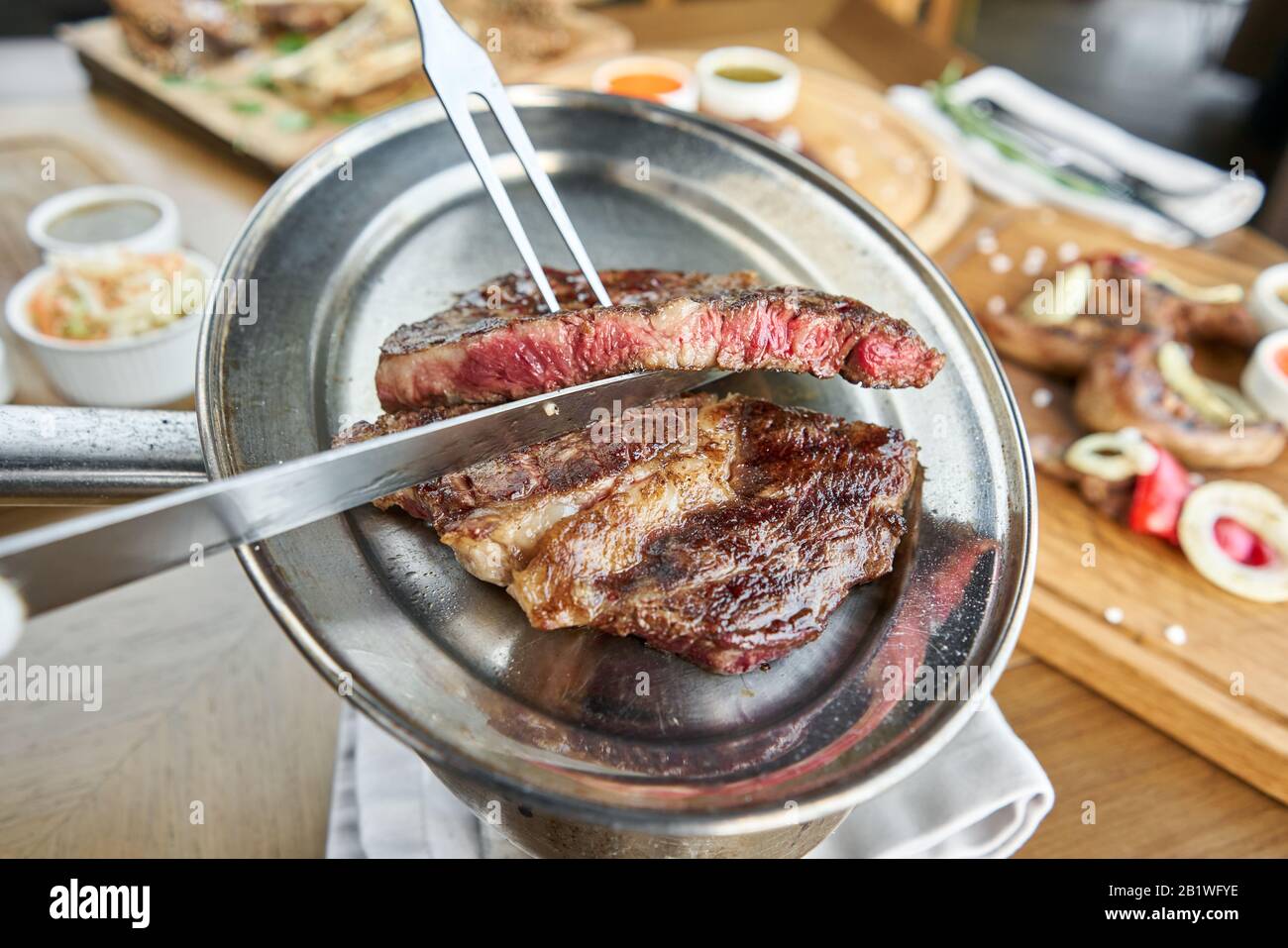 Grilled striploin steak. The strip steak or New York strip On a metal ...