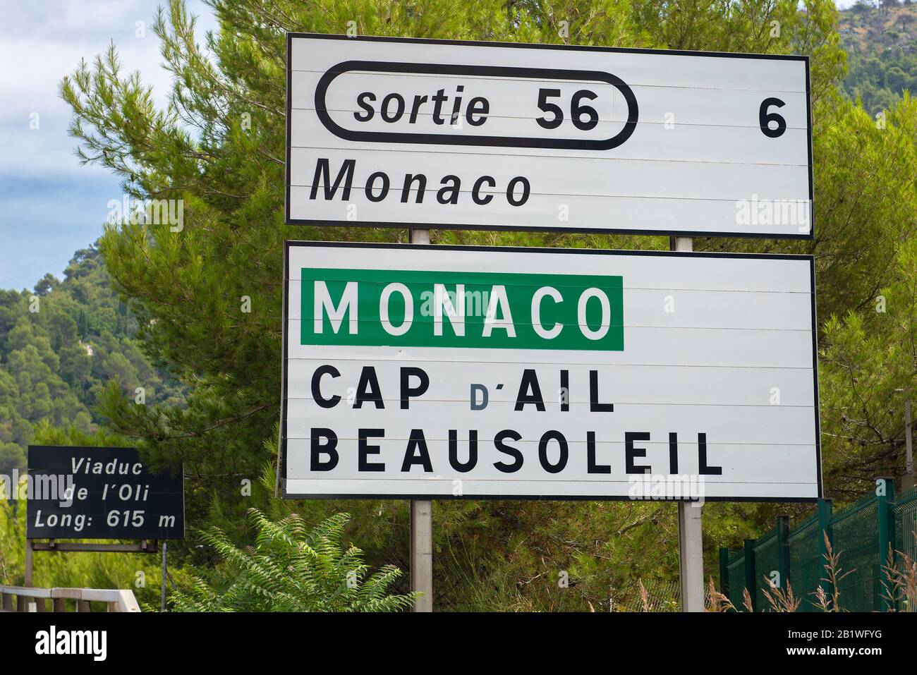Road sign with direction to Principality of Monaco (also Cap d'Ail and ...