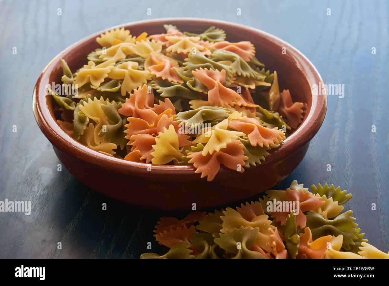 loop pasta, bright natural colors, basil green and red tomatoes, with ...